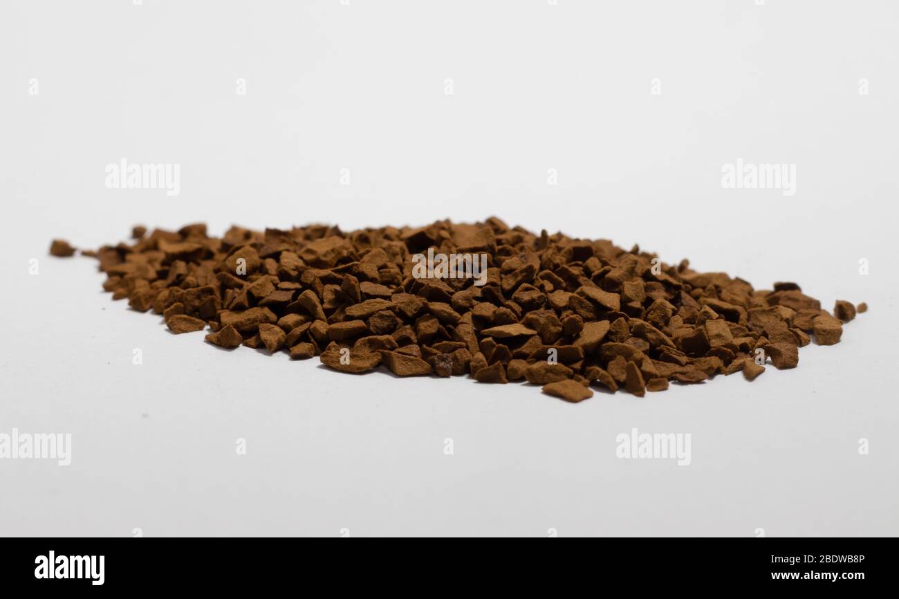 Close-up of granules of granulated instant coffee, white background ...