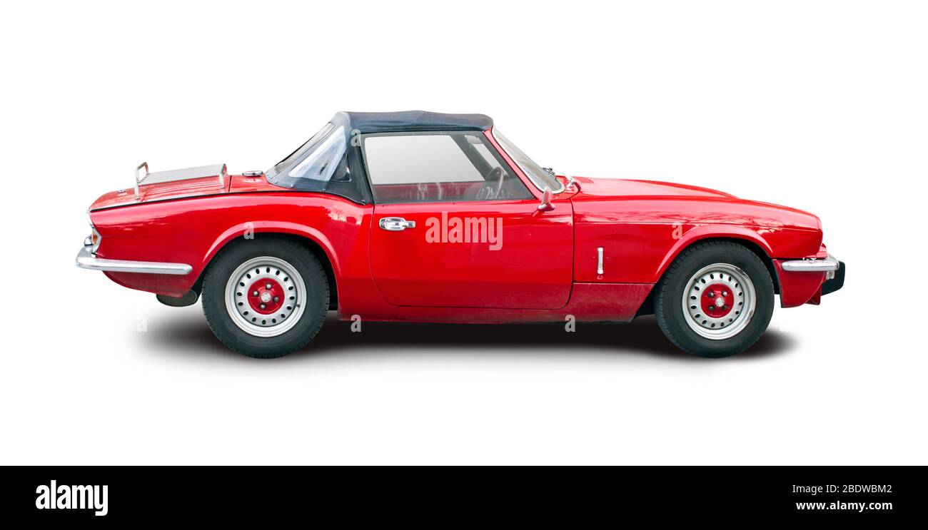 Classic British red sport cabrio car isolated on white Stock Photo - Alamy