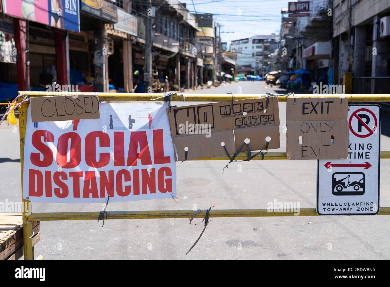 A makeshift barrier within a market area of Cebu City emphasising the ...
