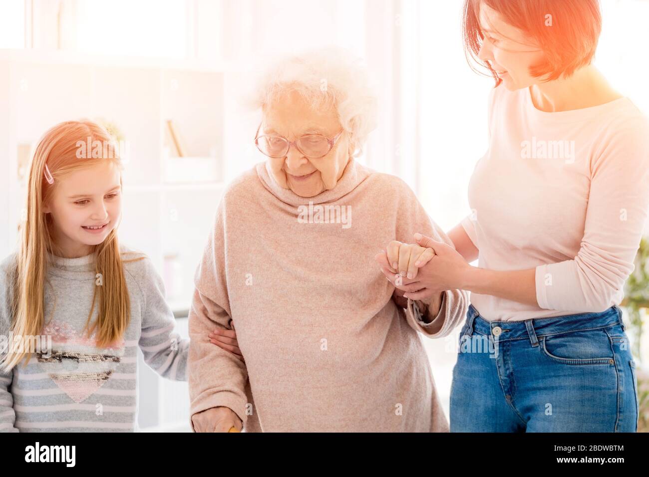 Three generation of women supporting each other Stock Photo - Alamy