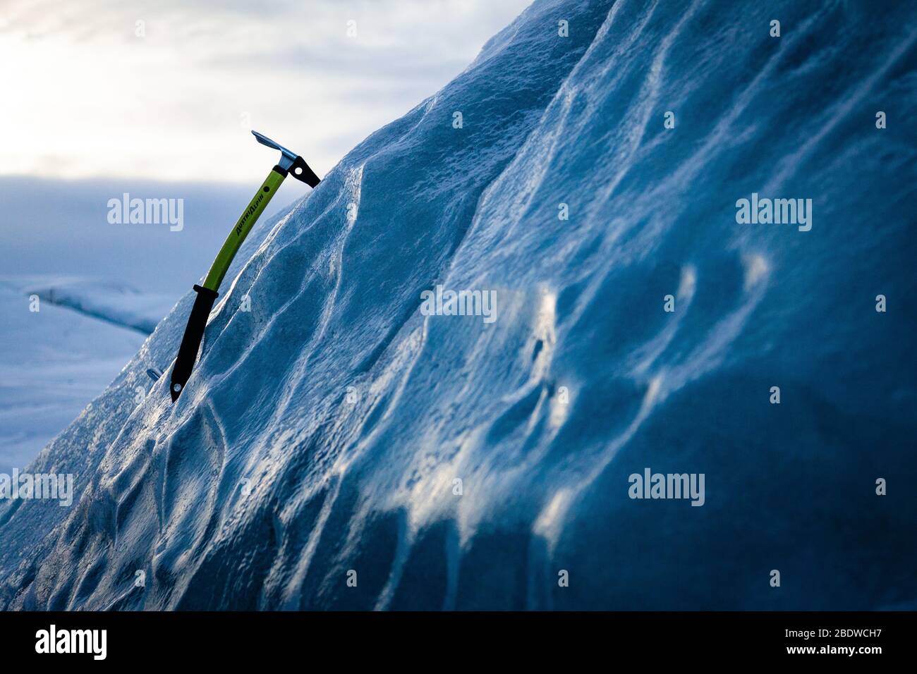 An ice axe embedded in the glacier wall on the Svinafellsjokull glacier ...