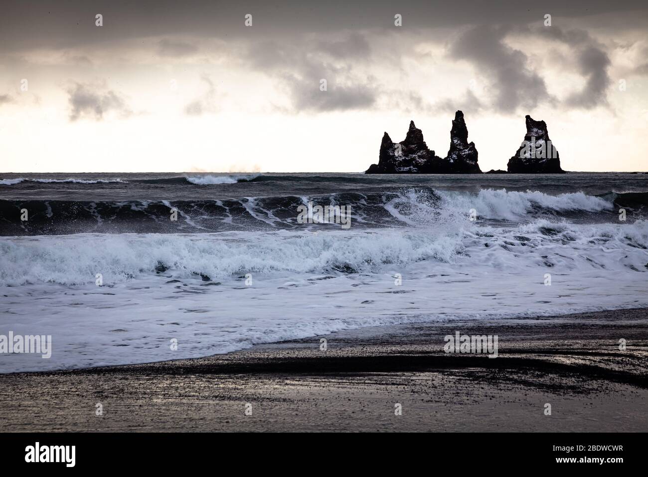 Reynisdrangar basalt sea stacks in winter at Vík í Mýrdal on Iceland's ...