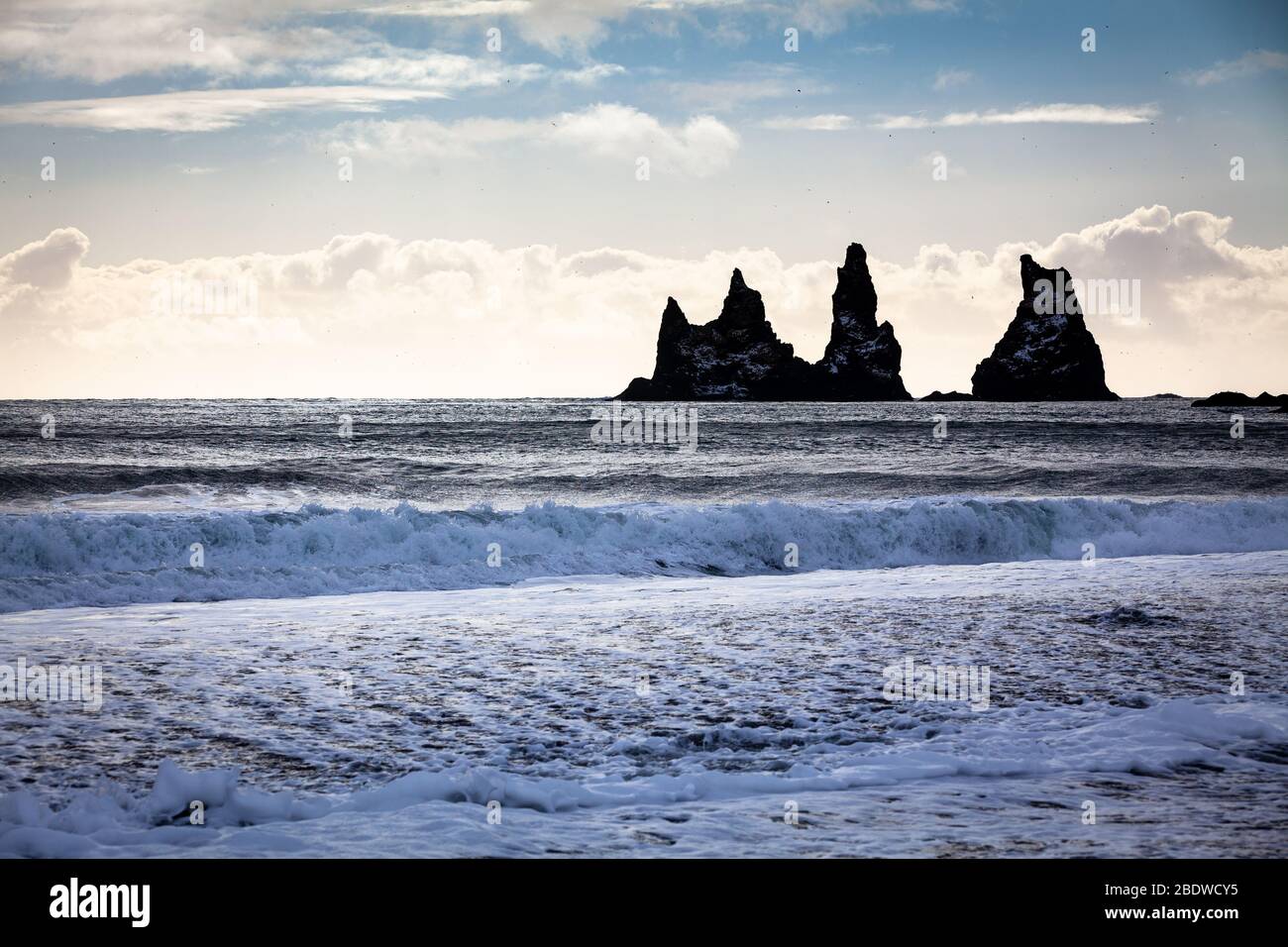 Reynisdrangar basalt sea stacks in winter at Vík í Mýrdal on Iceland's ...