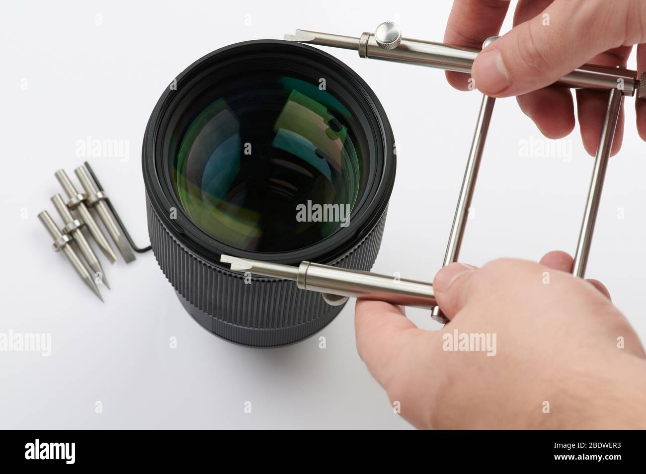 Open lens with big wide front glass with wrench tool Stock Photo - Alamy