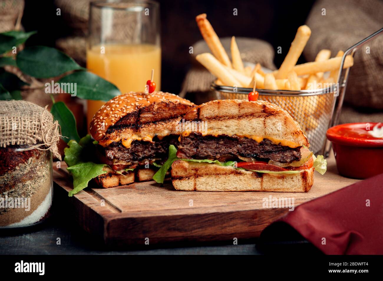 classic sliced hamburger on the table Stock Photo - Alamy