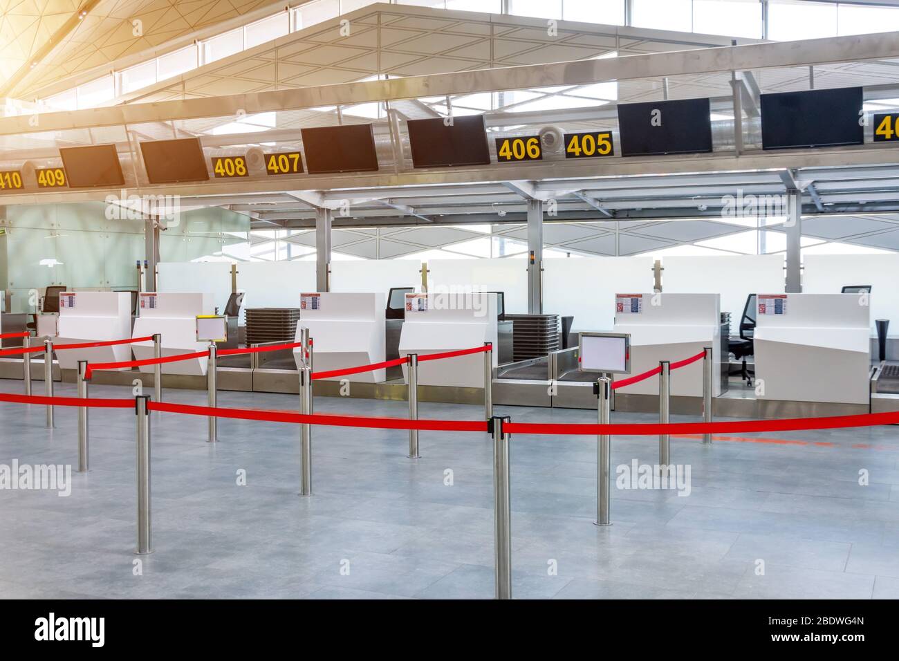 Empty check-in desks for drop off baggage with paths canceled with a ...