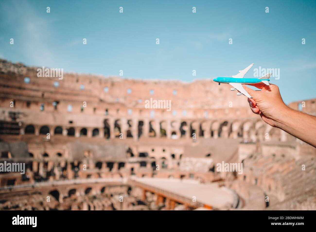 Small airplane model background Coliseum, Rome, Italy Stock Photo - Alamy