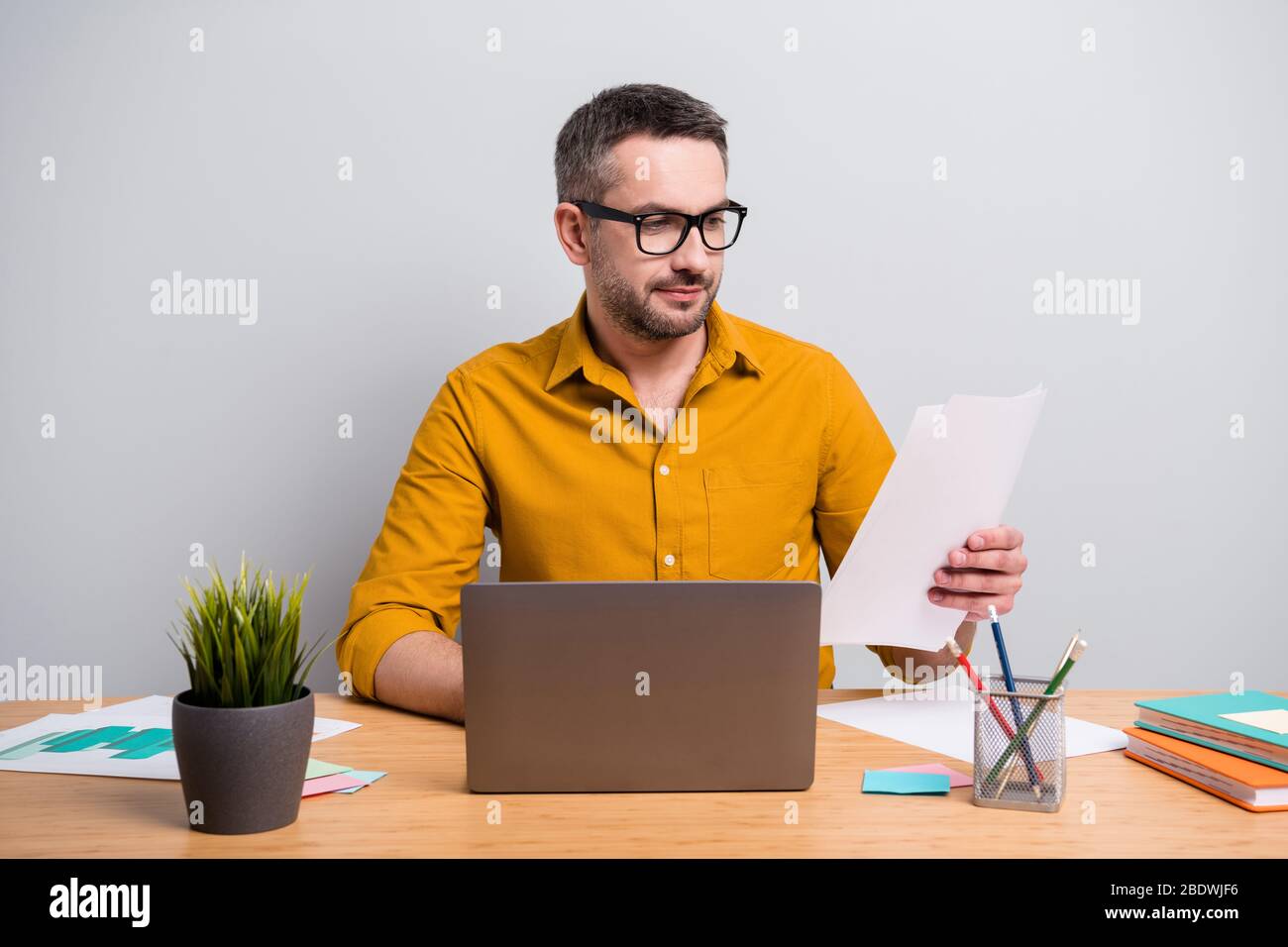 Portrait of serious concentrated man chief executive man manager sit ...