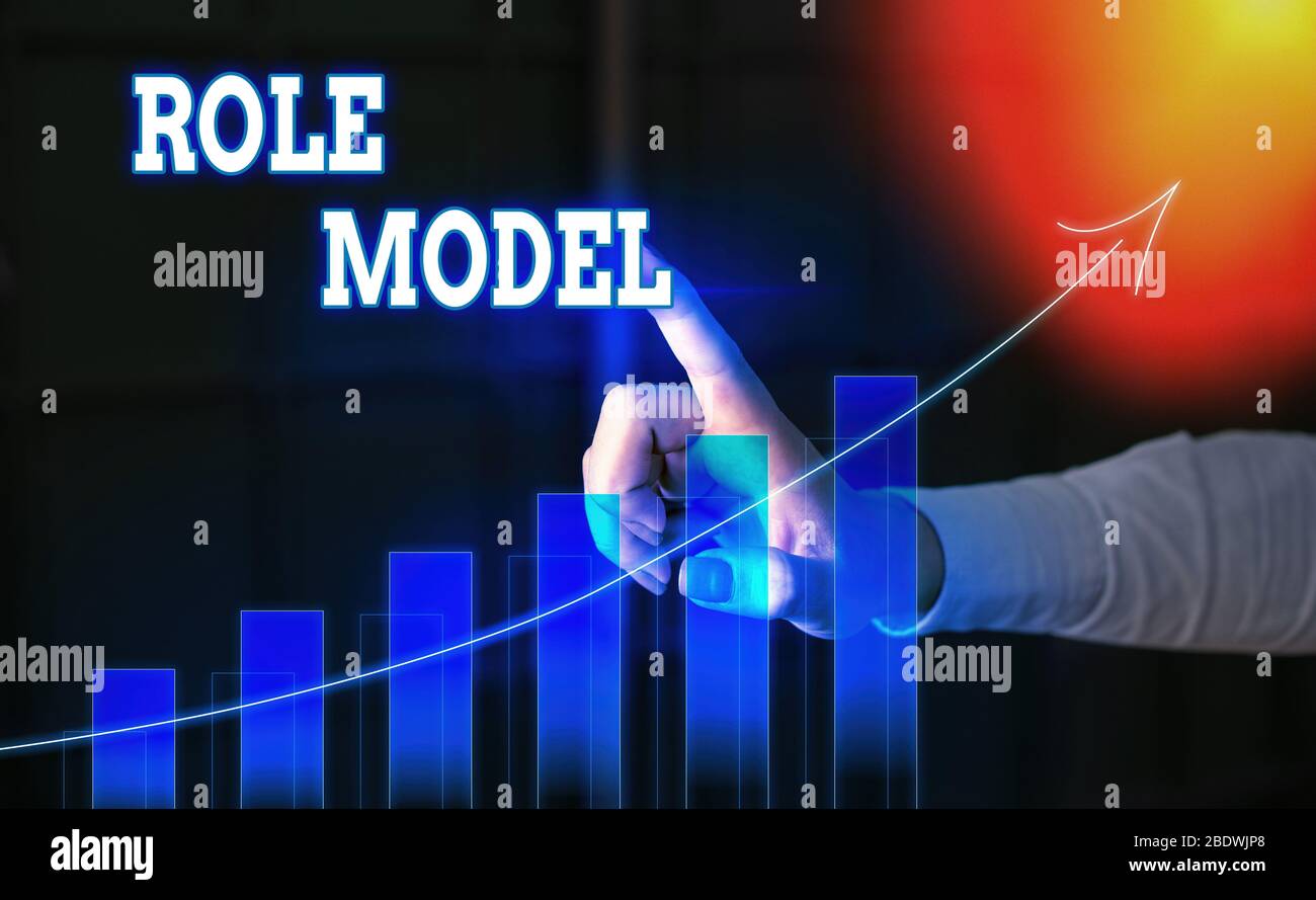 Conceptual hand writing showing Role Model. Concept meaning a ...
