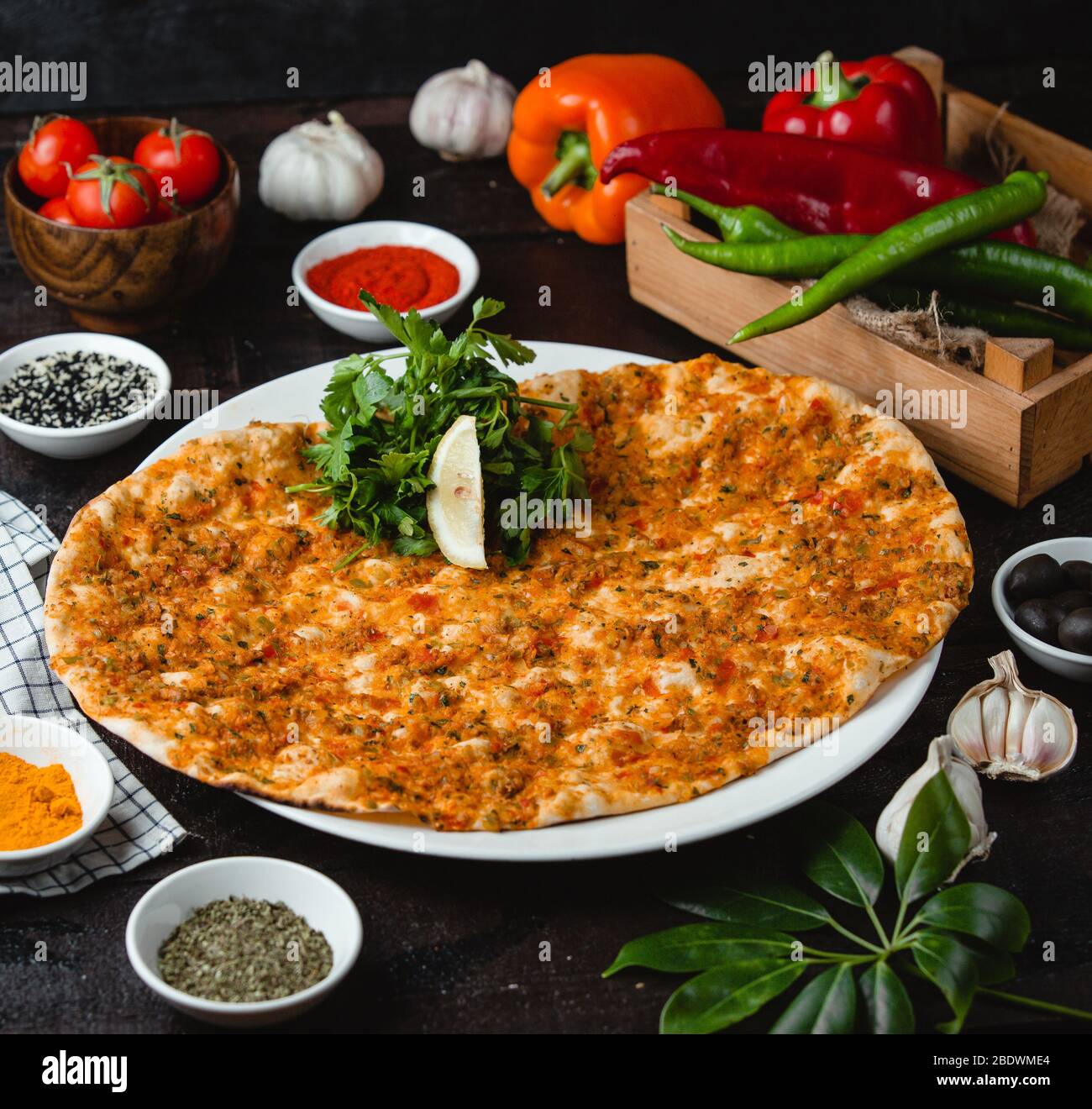 turkish lahmajun with stuffed meat, a slice of lemon and herbs Stock ...