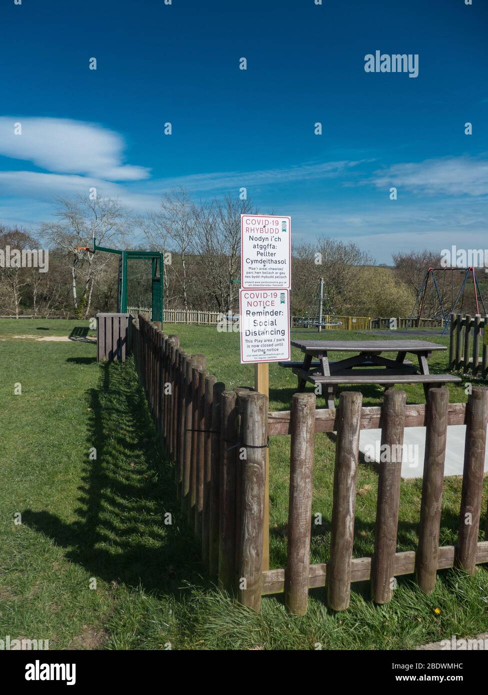 Covid19 social distancing notice in playground Stock Photo - Alamy