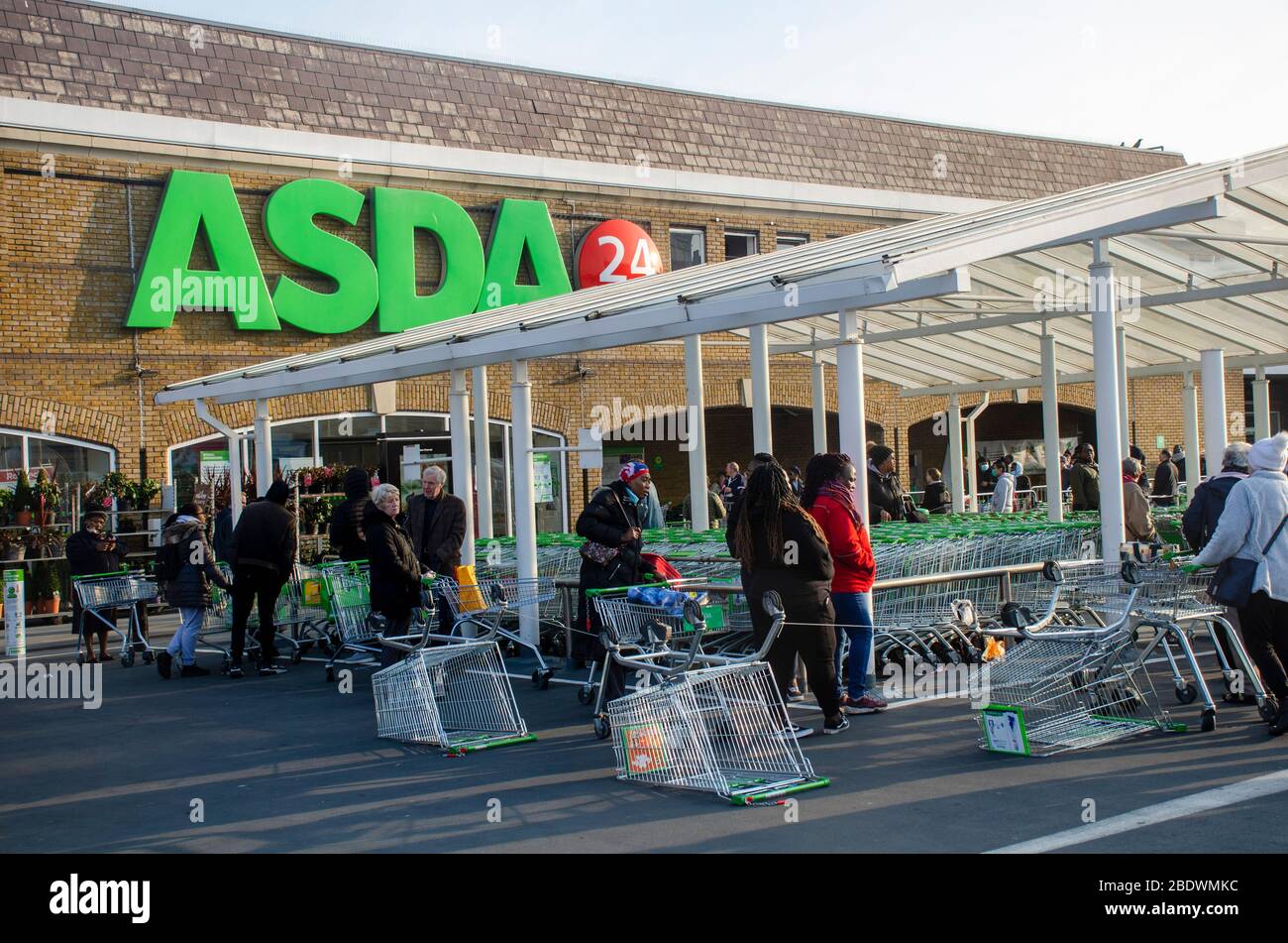 London, UK, 10 April 2020 Easter Weekend queue at Asda Clapham junction ...