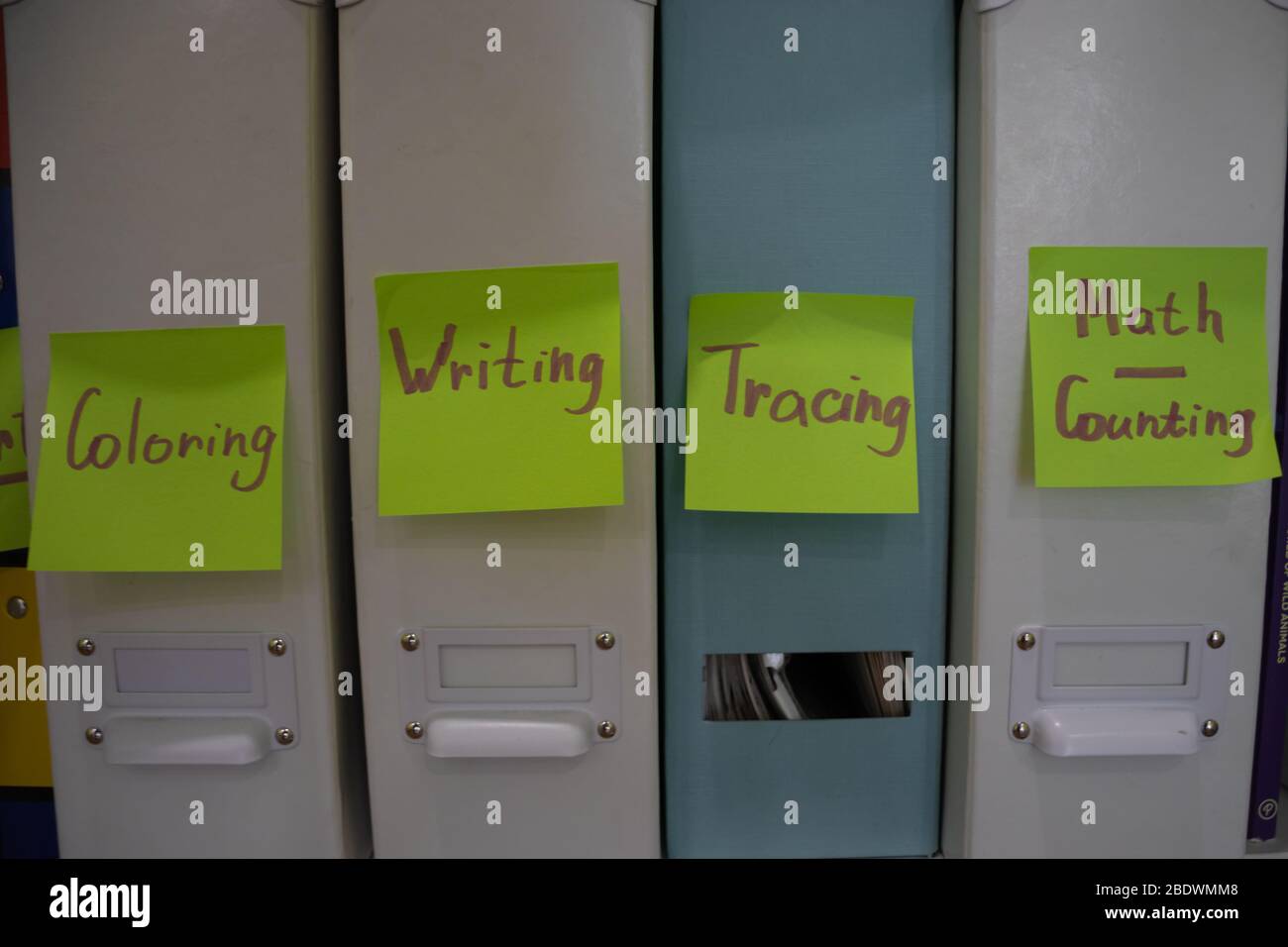 Paper Stickers on folders in the office with the inscriptions: writing ...