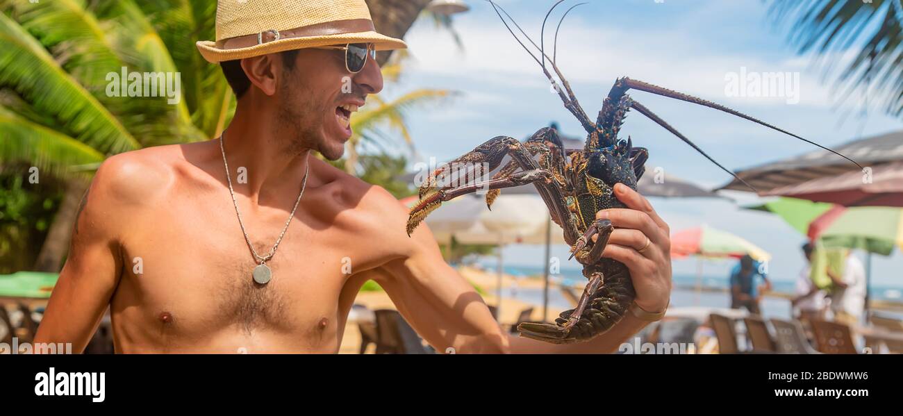 Live big lobster in the hands of people. Selective focus. nature Stock ...