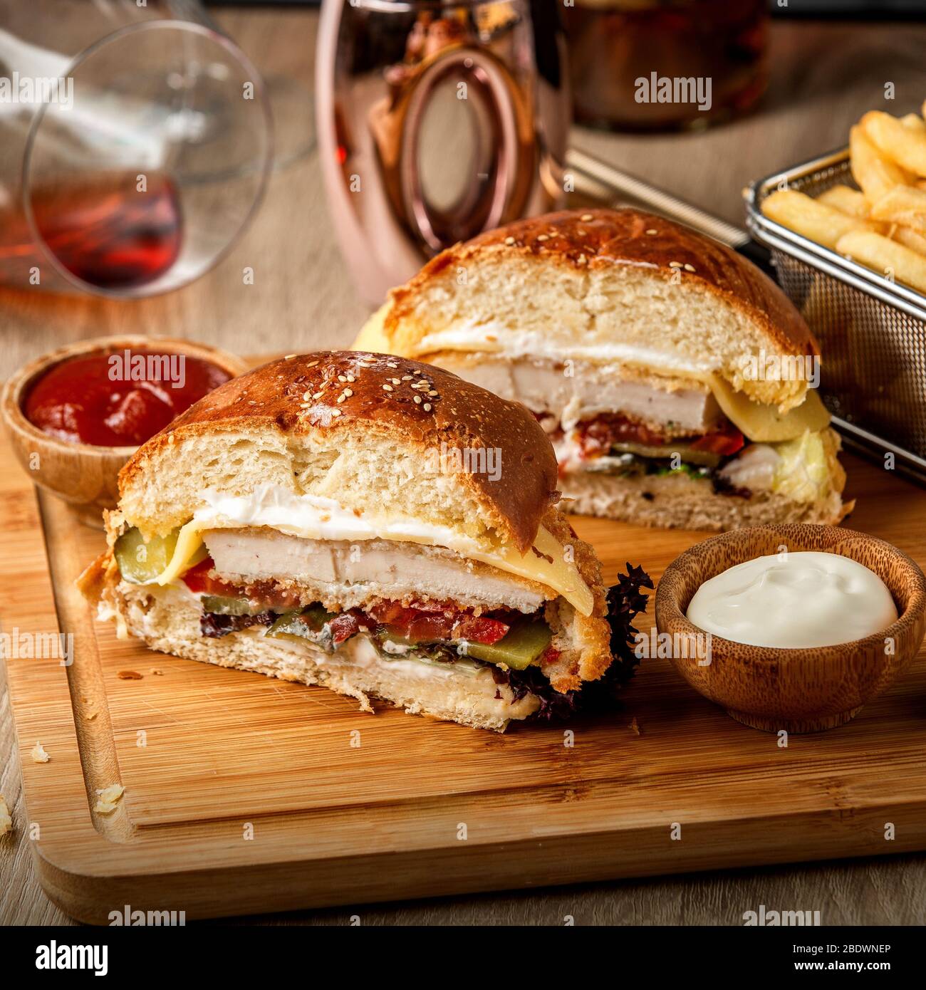 two slices of chicken burger Stock Photo - Alamy