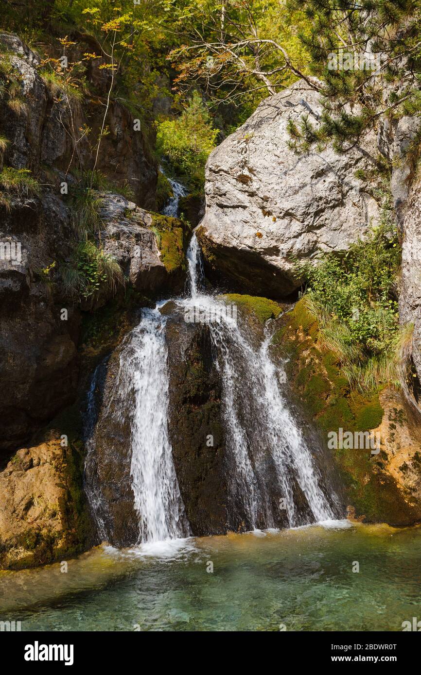 Enipeas waterfall with small lake surrounded by trees Stock Photo - Alamy