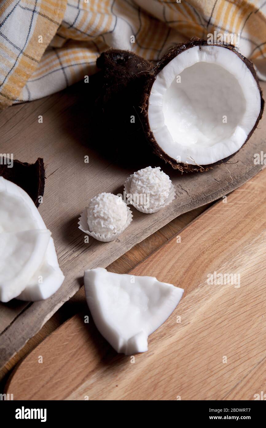 Coconut and sweet chocolate coconut truffles. Coconut shell, coconut ...