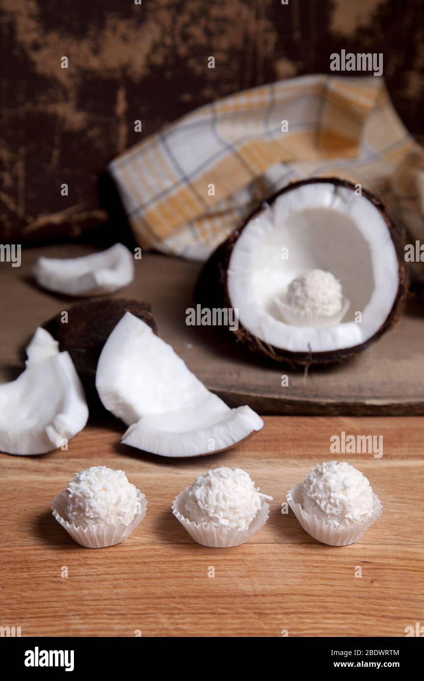 Coconut and sweet chocolate coconut truffles. Coconut shell, coconut ...