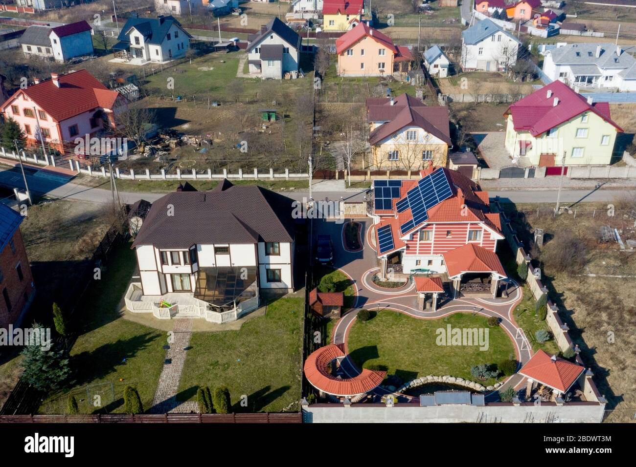 aerial view of houses on Ukraine housing estates, some with building on ...