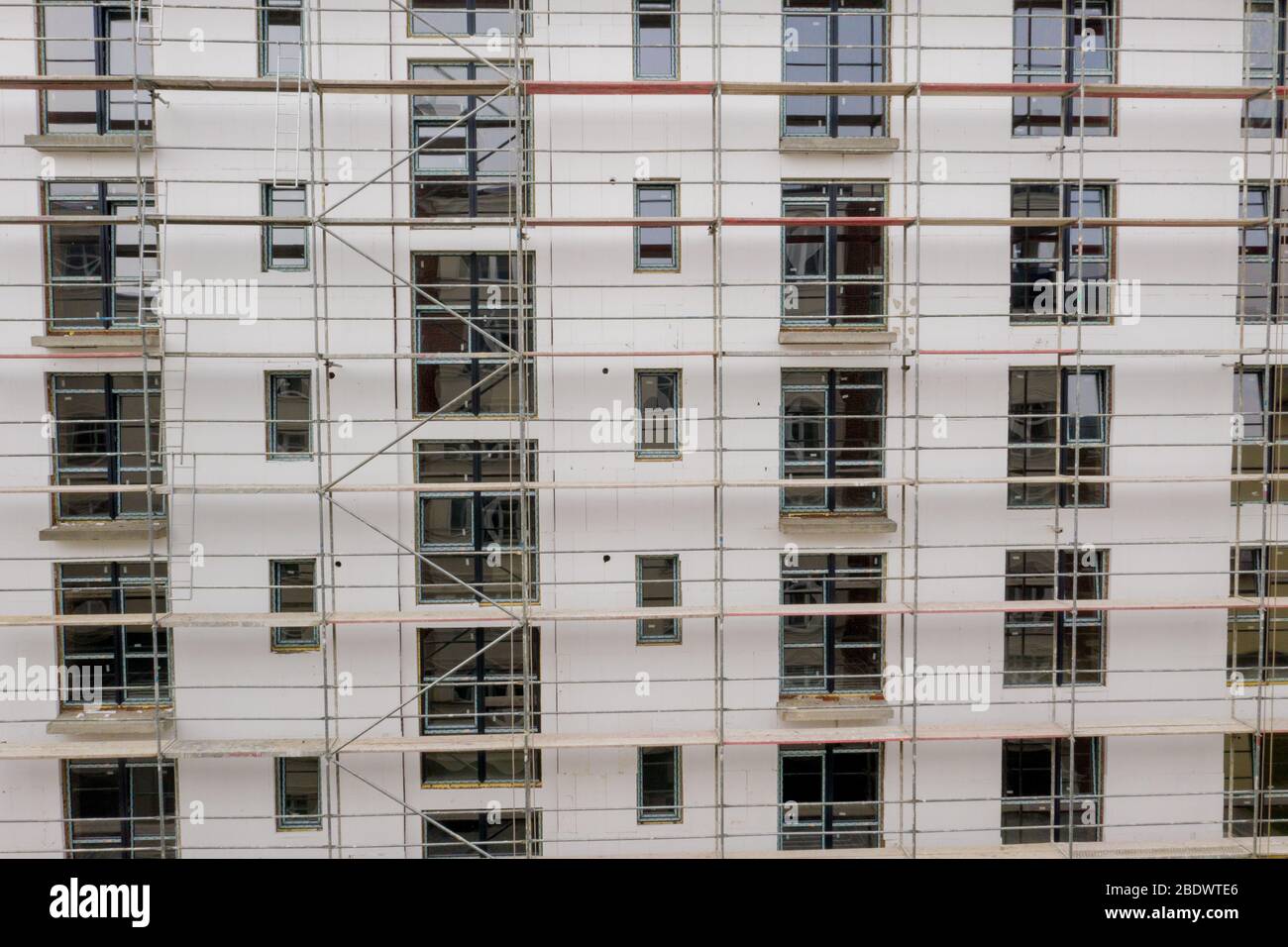 scaffold near the high-rise building for plaster Stock Photo - Alamy