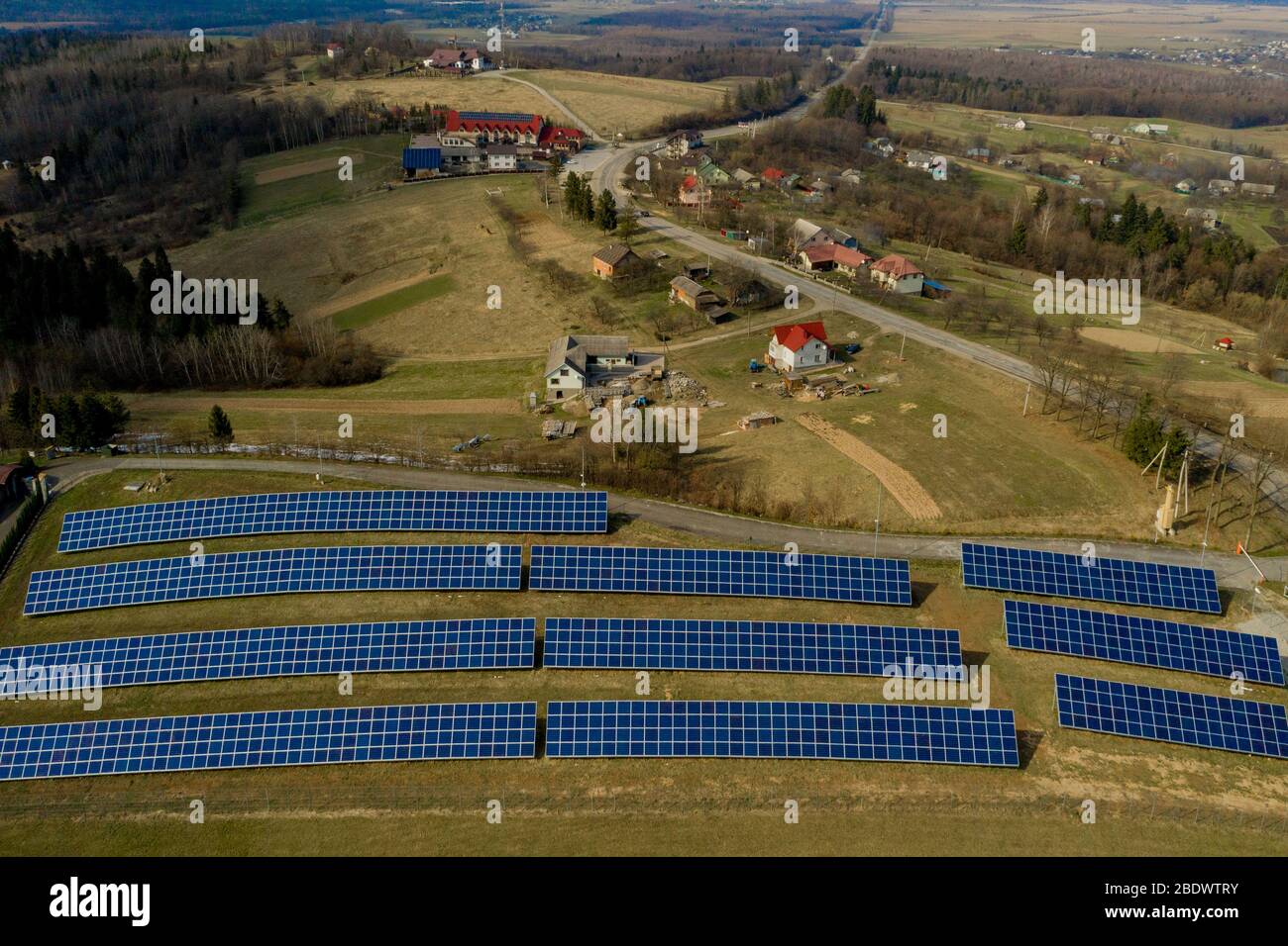 Aerial view of large field of solar photo voltaic panels system ...