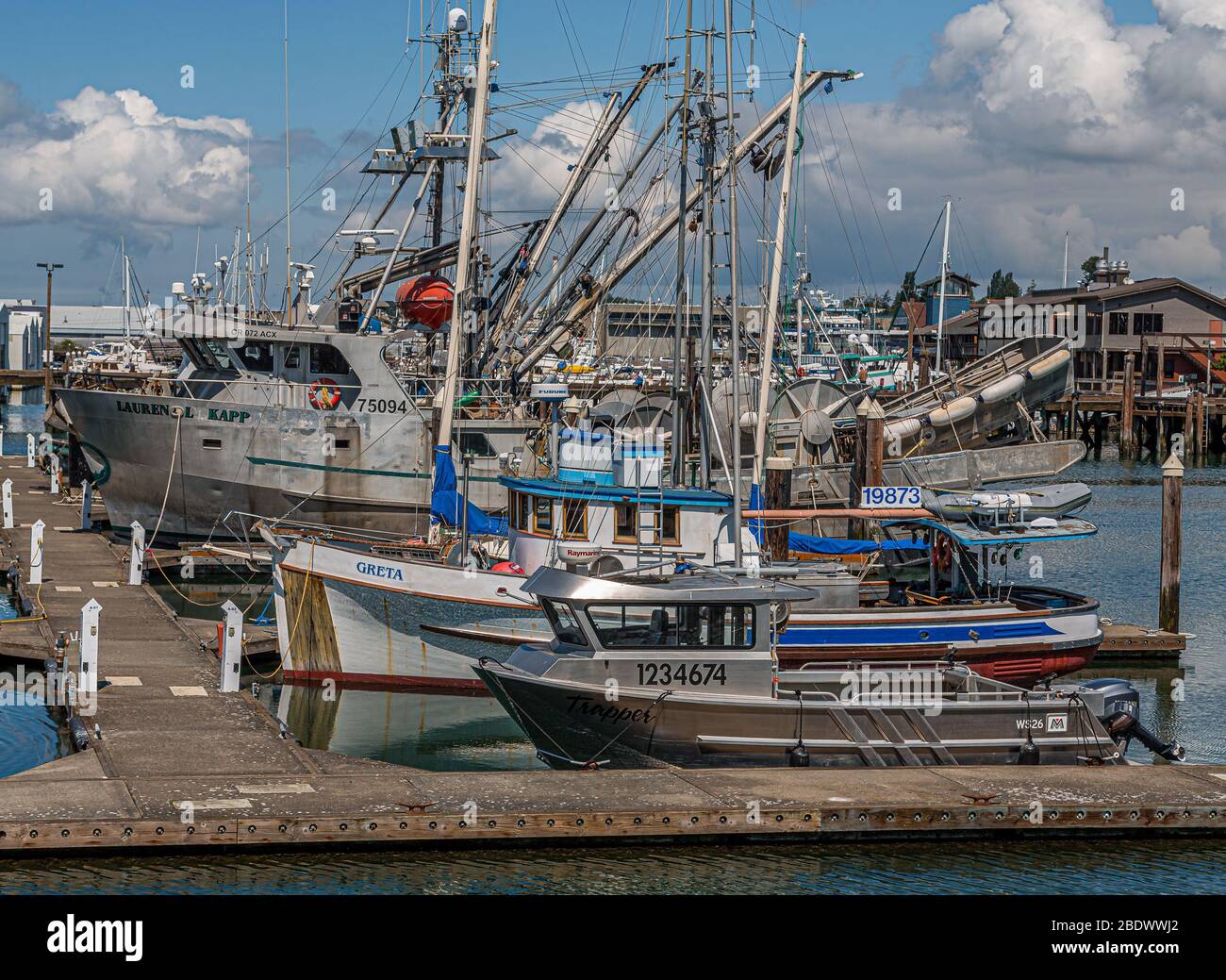 Row of fishing boats hi-res stock photography and images - Alamy