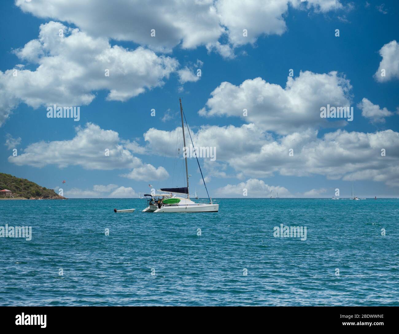 Sailboat Under Mast on Blue Water Stock Photo - Alamy