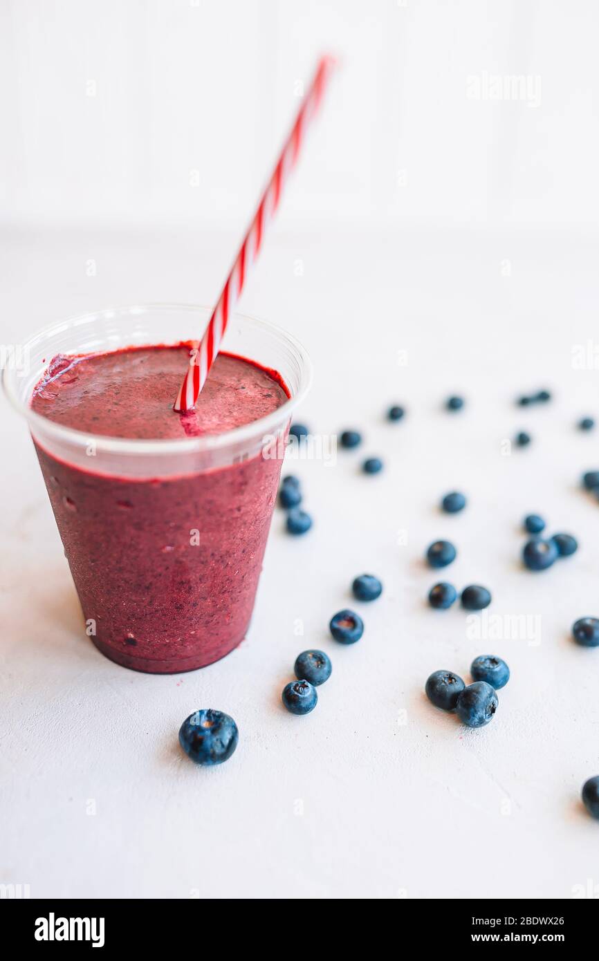 Row of healthy fresh fruit and vegetable smoothies with assorted ...