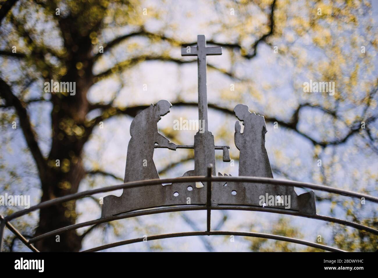 sign of metallic monks and crucifix in front of old monastery Stock ...