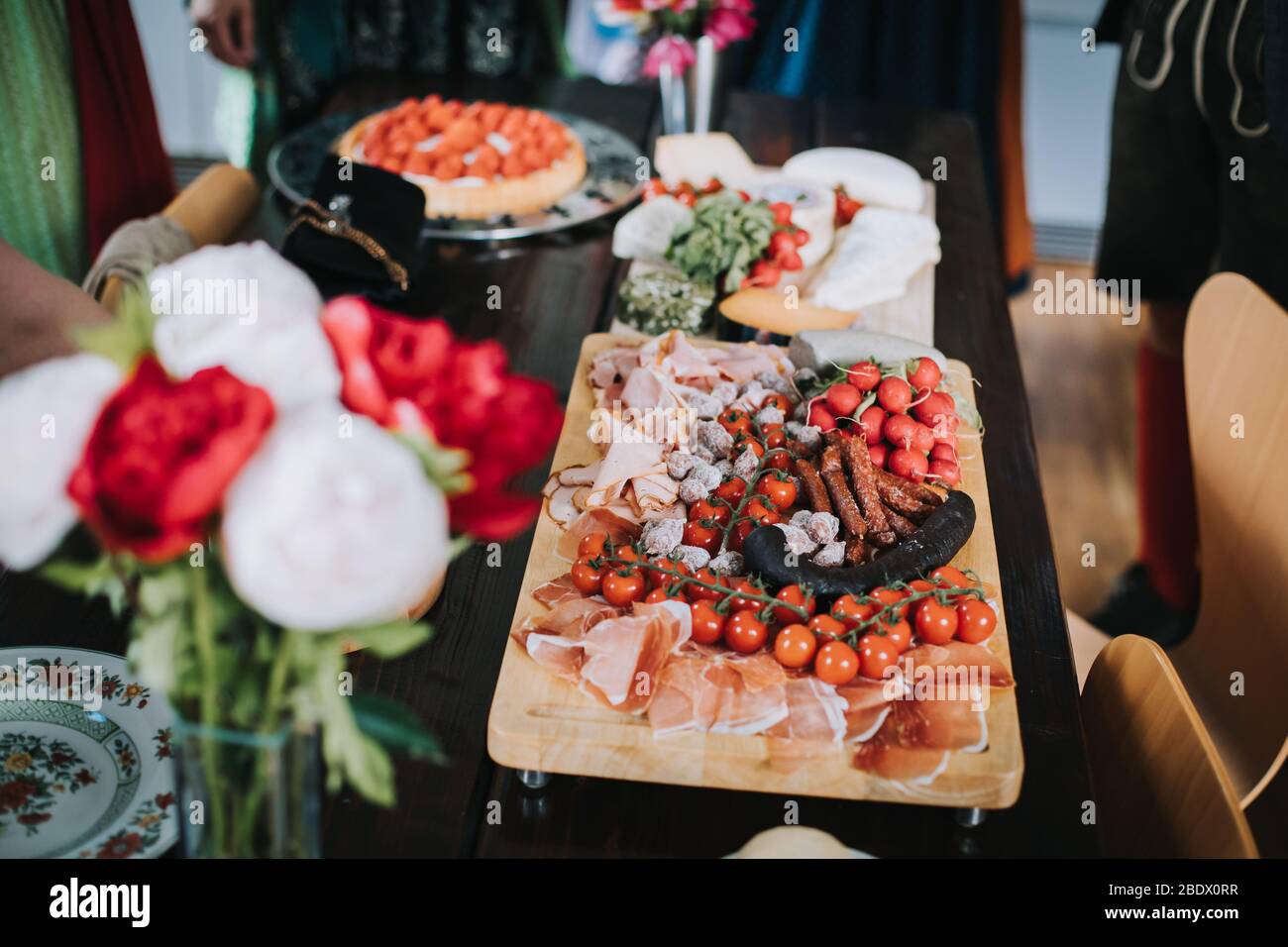 Italian food tray with delicious salami, pieces of sliced ham, sausage ...