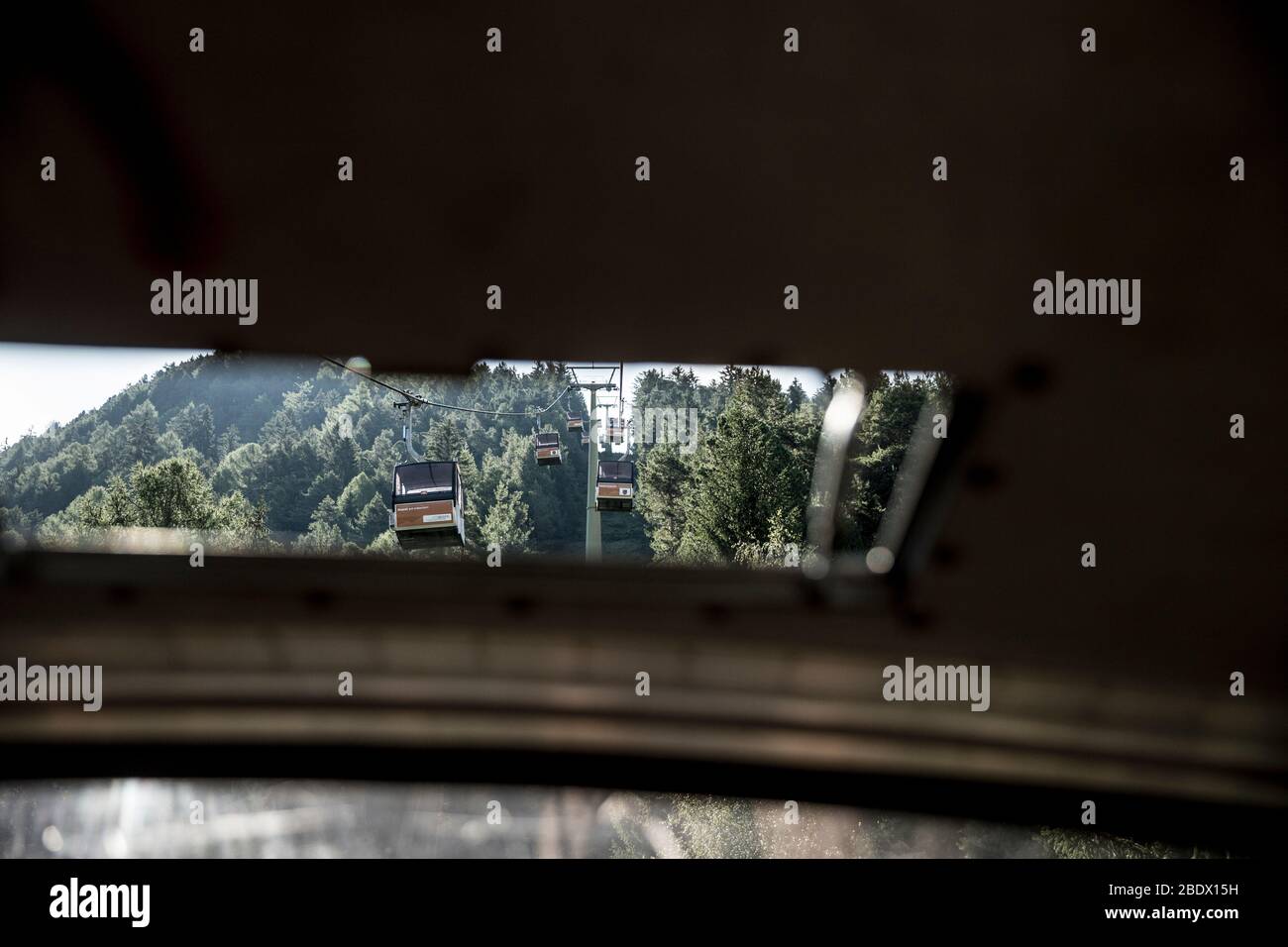 View through cable car skylight of cable cars on the way to Plose in ...
