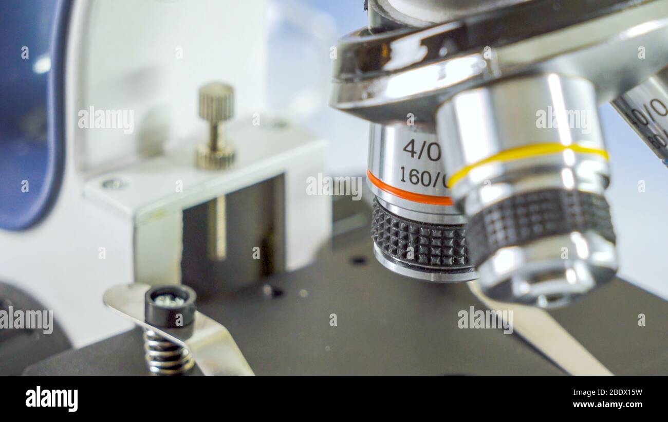 Closer look of the objective lens of the microscope inside the ...