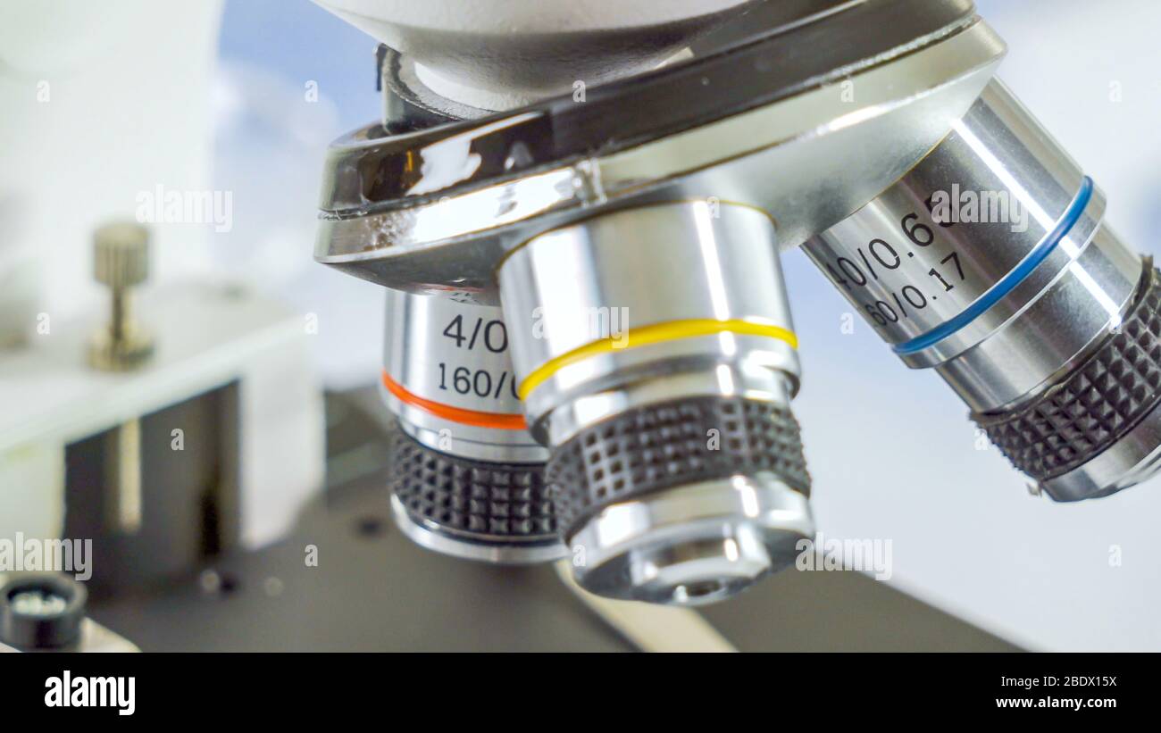 Closer look of the objective lens of the microscope inside the ...