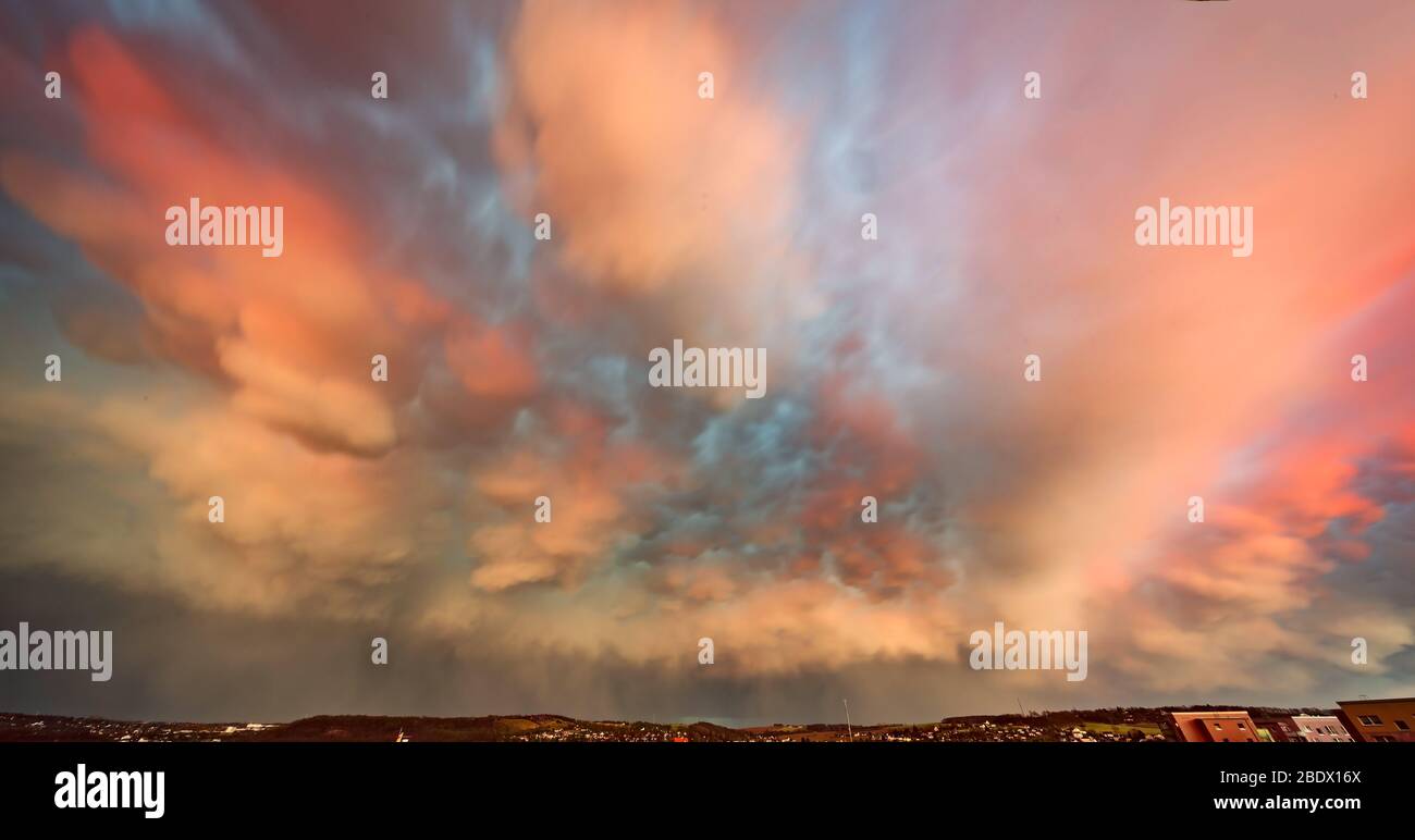 Dramatic sky with thunderclouds. Pink Clouds Illuminated by the Rays of ...