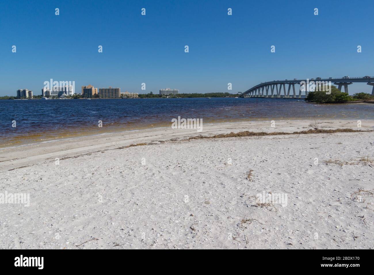Panoramic view to a bridge at the Florida Keys from a beautiful beach ...