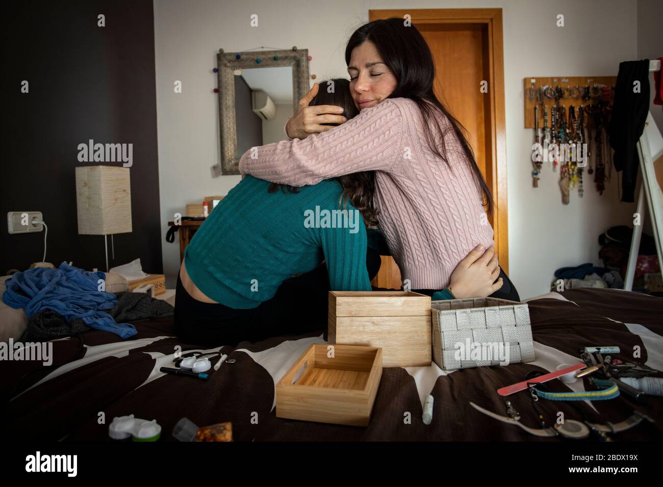 Mother giving daughter a cuddle during Covid19 confinement in Catalonia ...