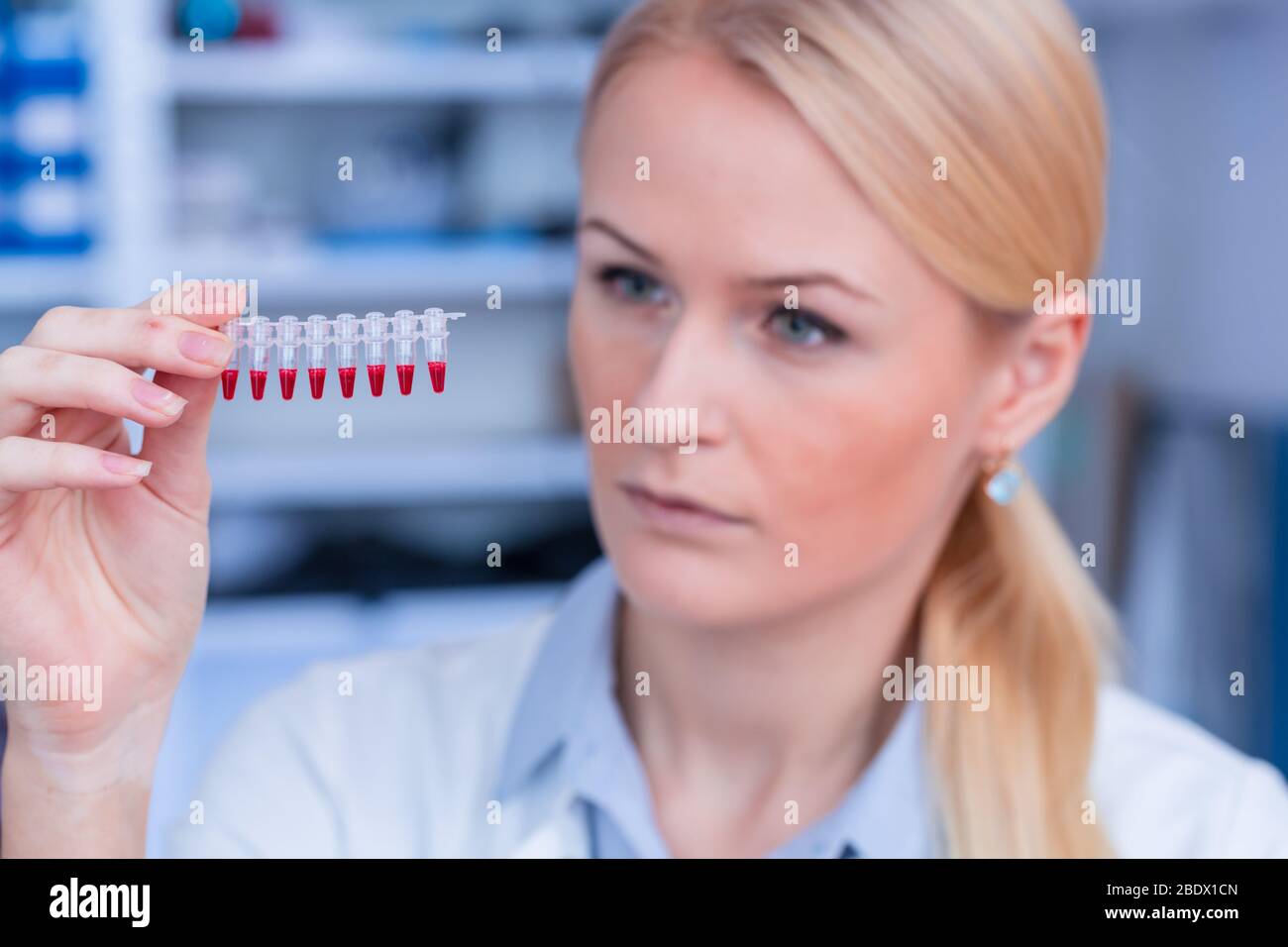 Girl laboratory Assistant works with an antiviral drug in a ...