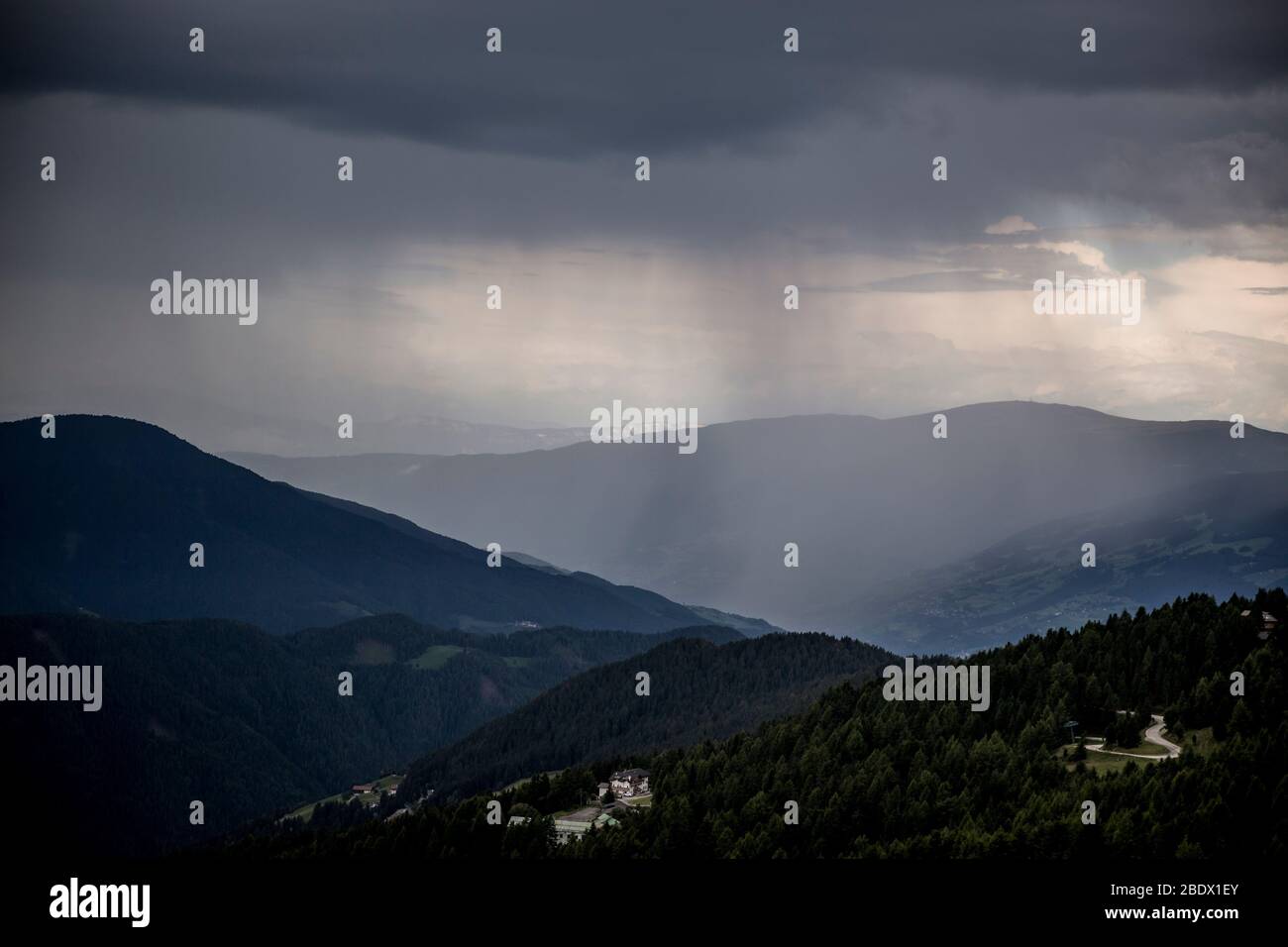 Rain falls over a valley in The Dolomites. South Tyrol, Italy Stock ...