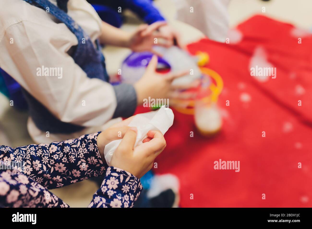 Mom wipes her daughter s palm with a damp napkin. Mom cares for her ...