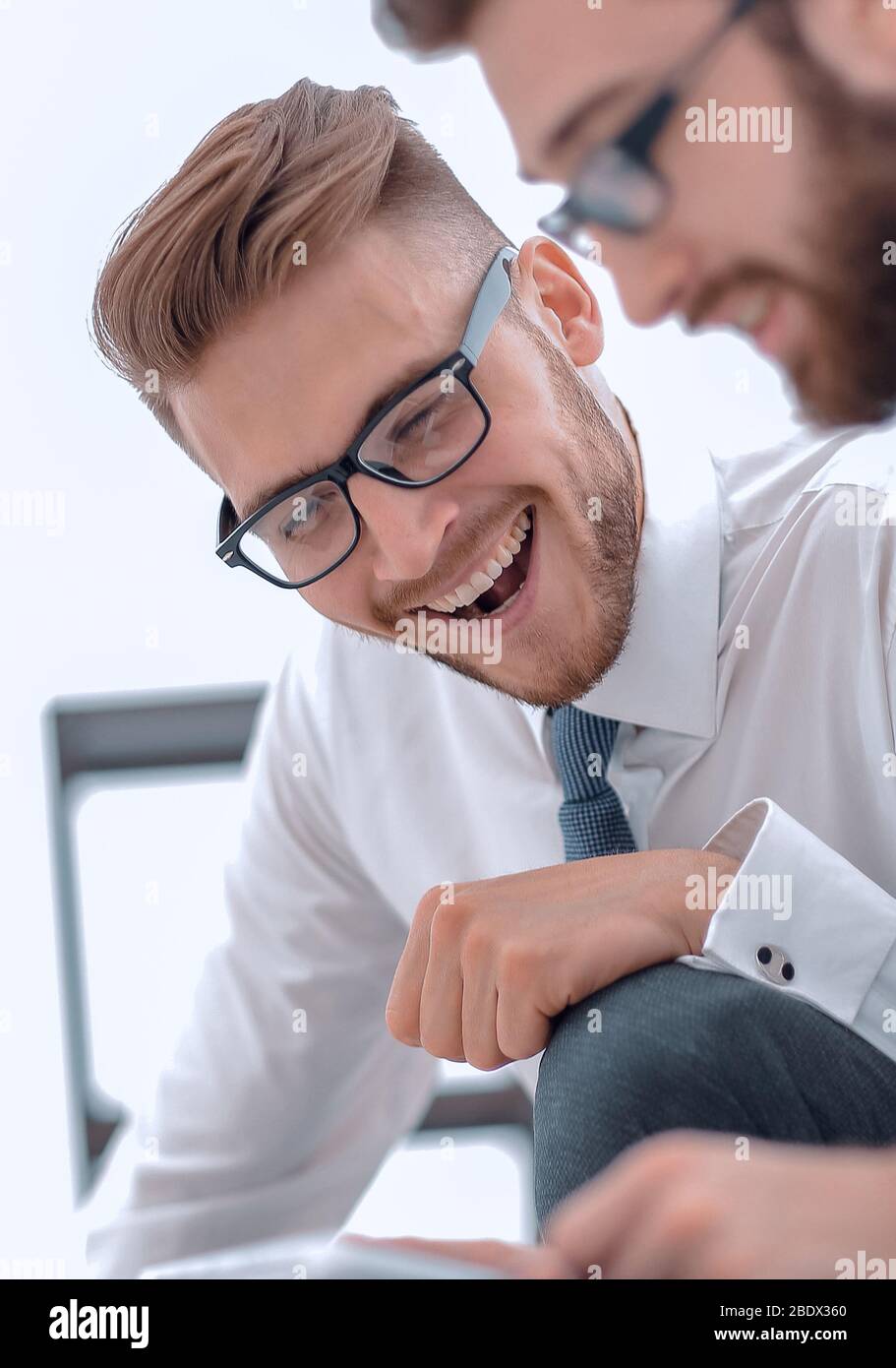 close up. two successful employees work together Stock Photo - Alamy