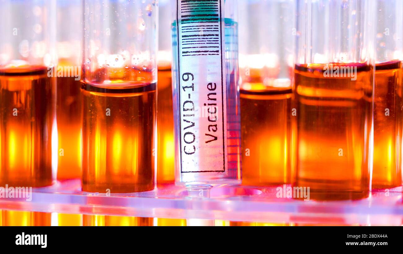 The upside down syringe with the coronavirus vaccine COVID-19 inside on ...