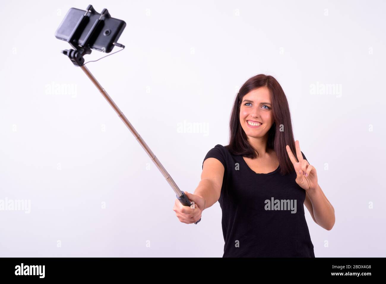 Female using selfie stick hi-res stock photography and images - Alamy