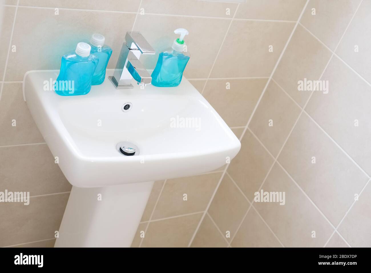 Anti bacterial blue hand wash on hand basin to prevent coronavirus and ...