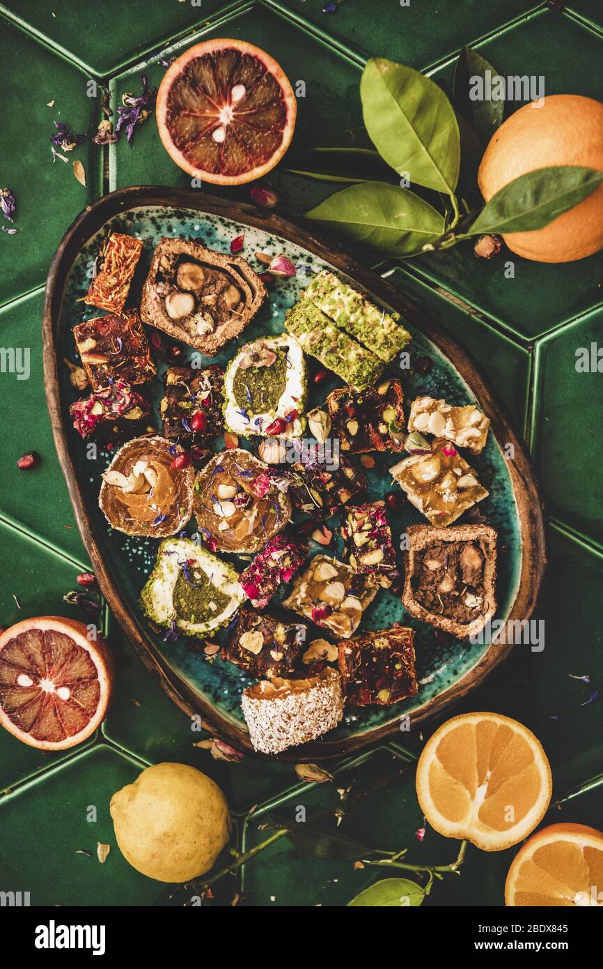 Turkish traditional lokum and fresh fruits over green tile table Stock ...