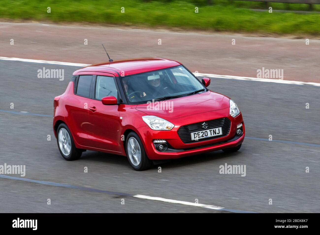 2020 red Suzuki Swift (A2L); Vehicular traffic moving vehicles, driving ...