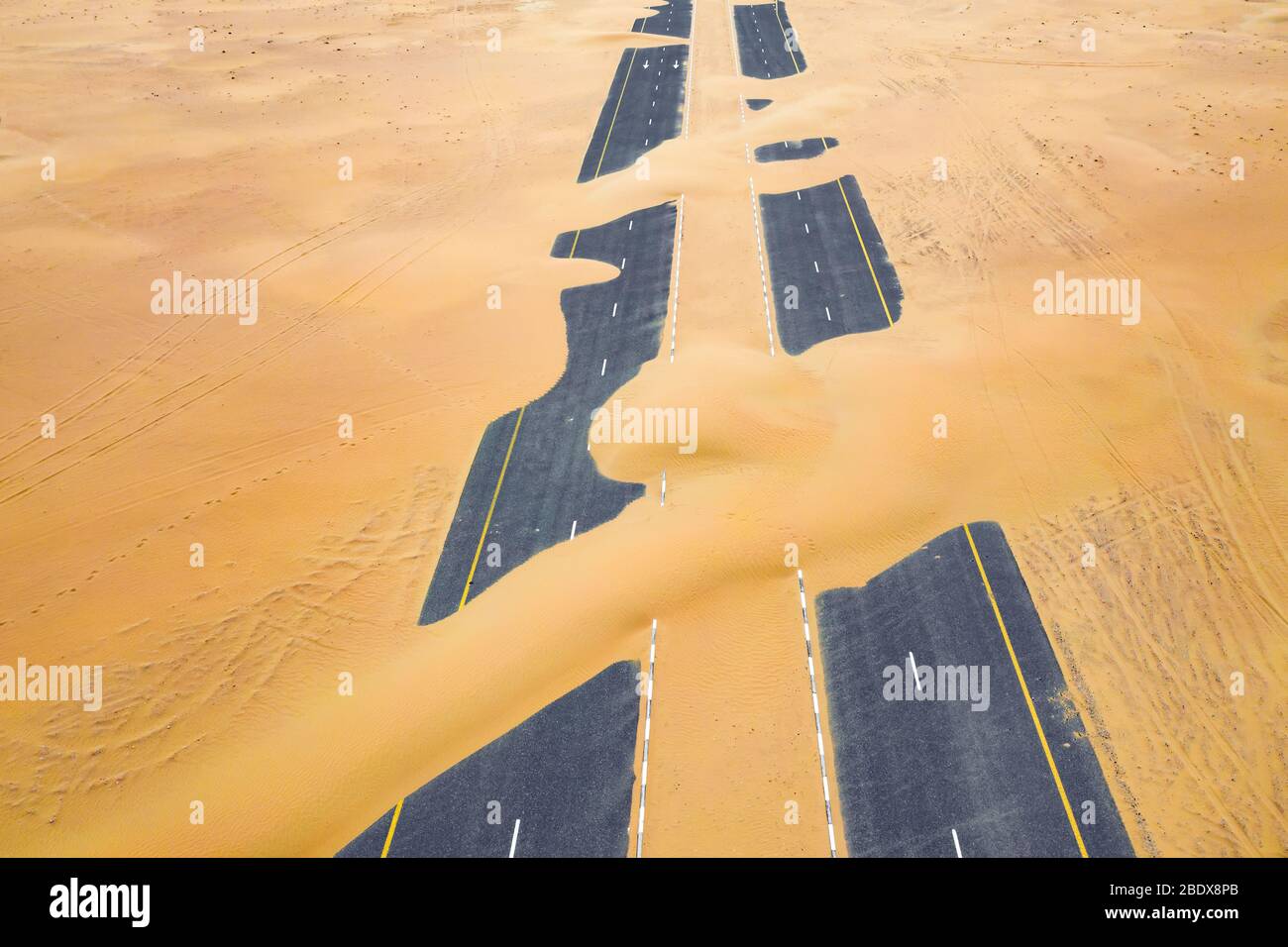 View from above, stunning aerial view of a deserted road covered by ...