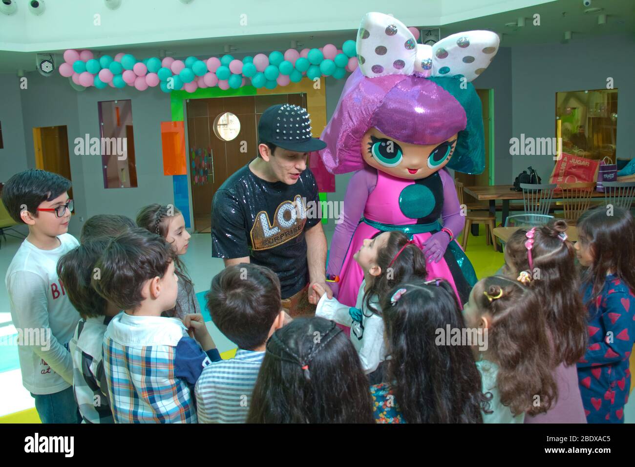 Children's birthday party with Lol animators. Happy group of children ...