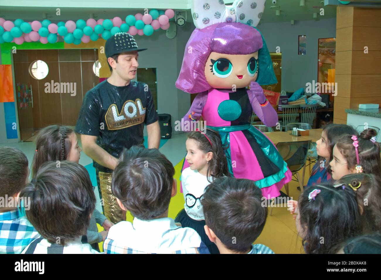 Children's birthday party with Lol animators. Happy group of children ...