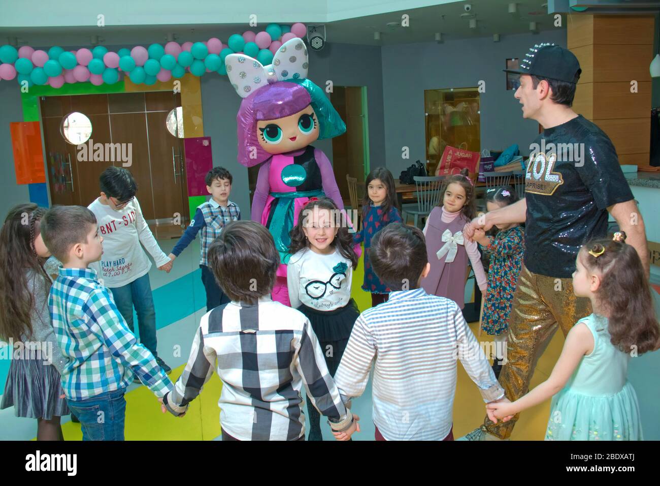 Children's birthday party with Lol animators. Happy group of children ...