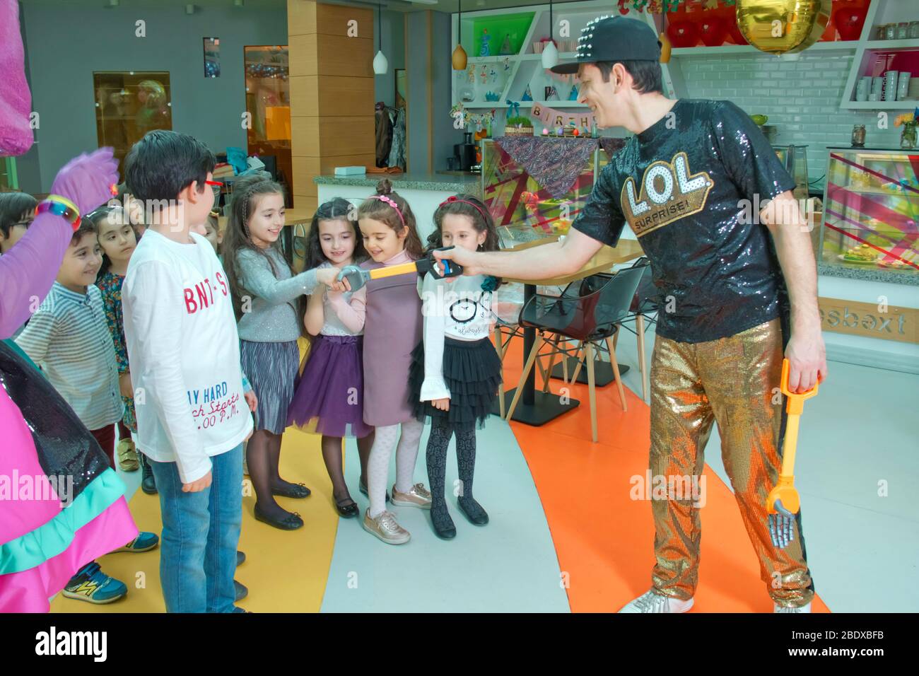 Children's birthday party with Lol animators. Happy group of children ...